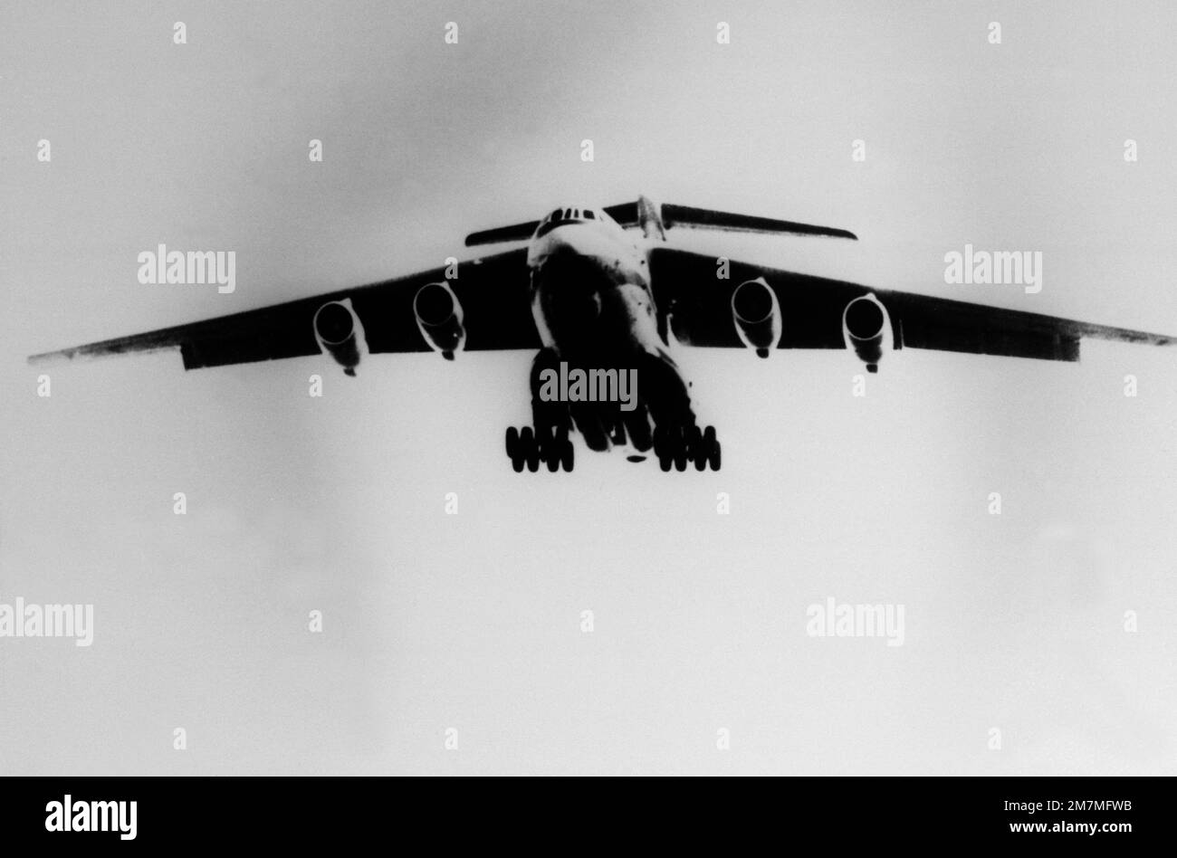 A front underside view of a Soviet II-76T Candid heavy transport ...