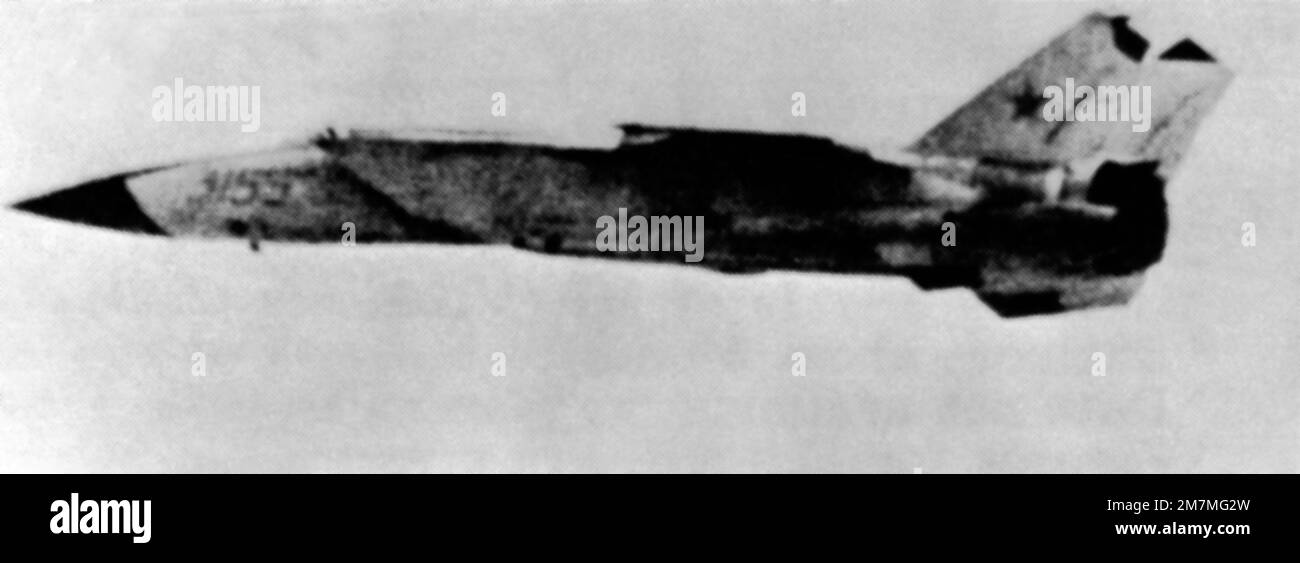 A left side view of a Soviet MiG-25 Foxbat fighter aircraft in flight ...