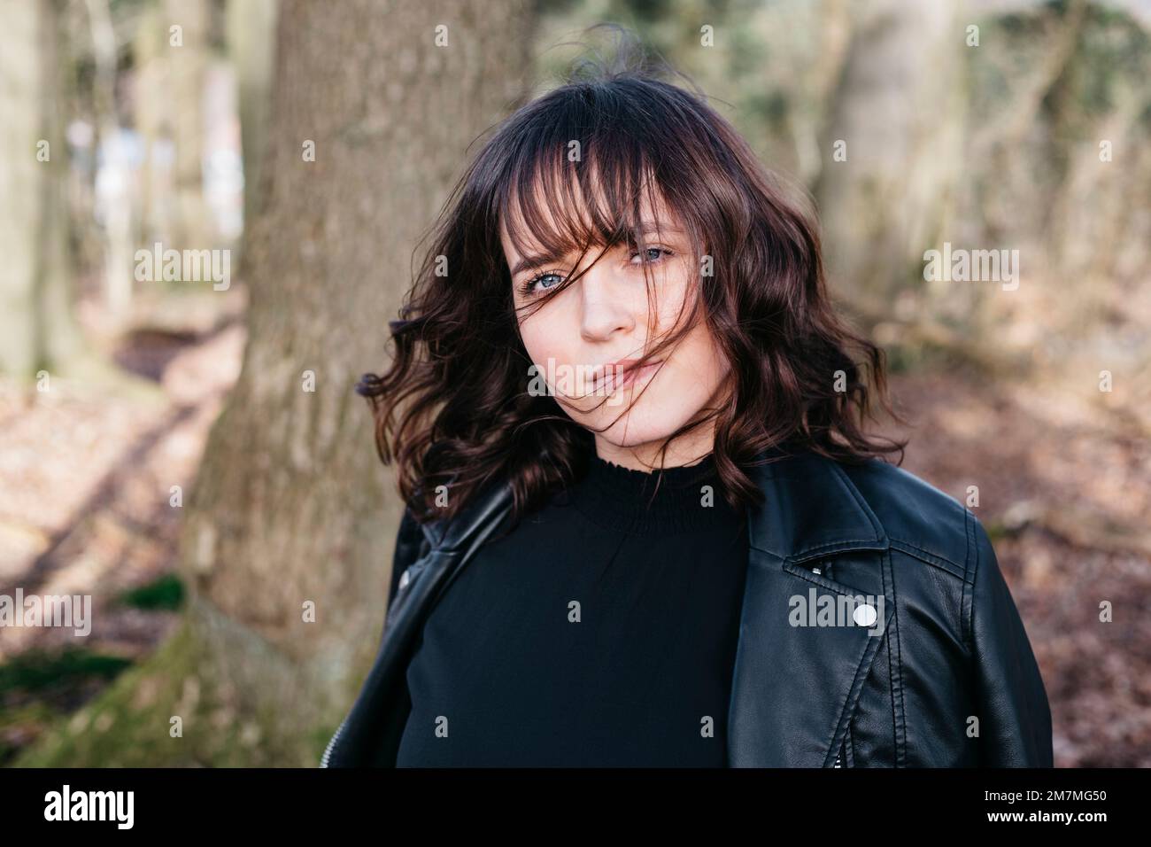 Portrait of a young woman in the forest Stock Photo - Alamy
