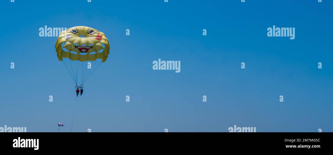 Children's parasailing. Summer vacation water sports. Fun at sea ...