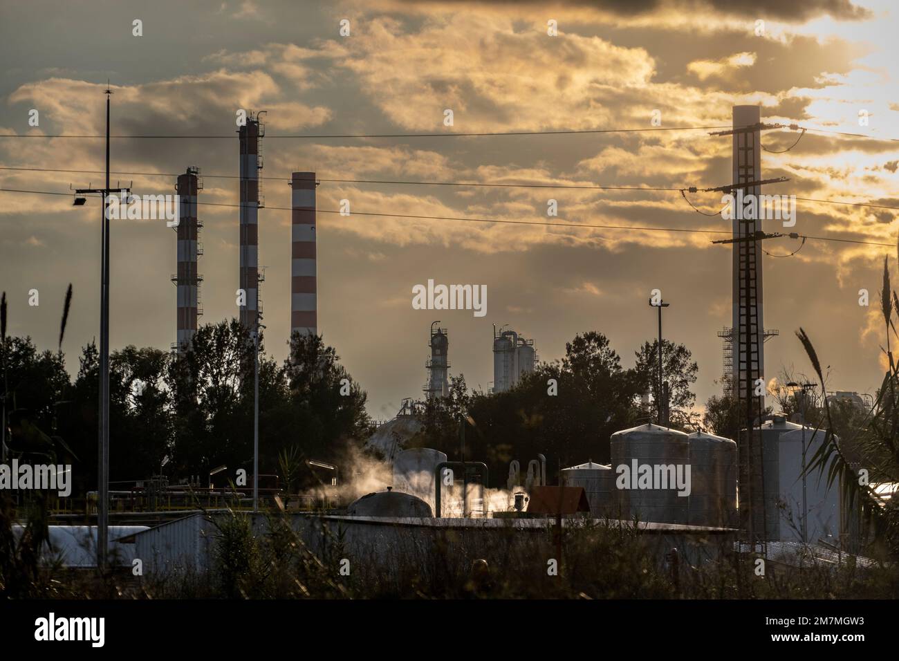 Industrial landscape of a refinery at sunset in the province of ...