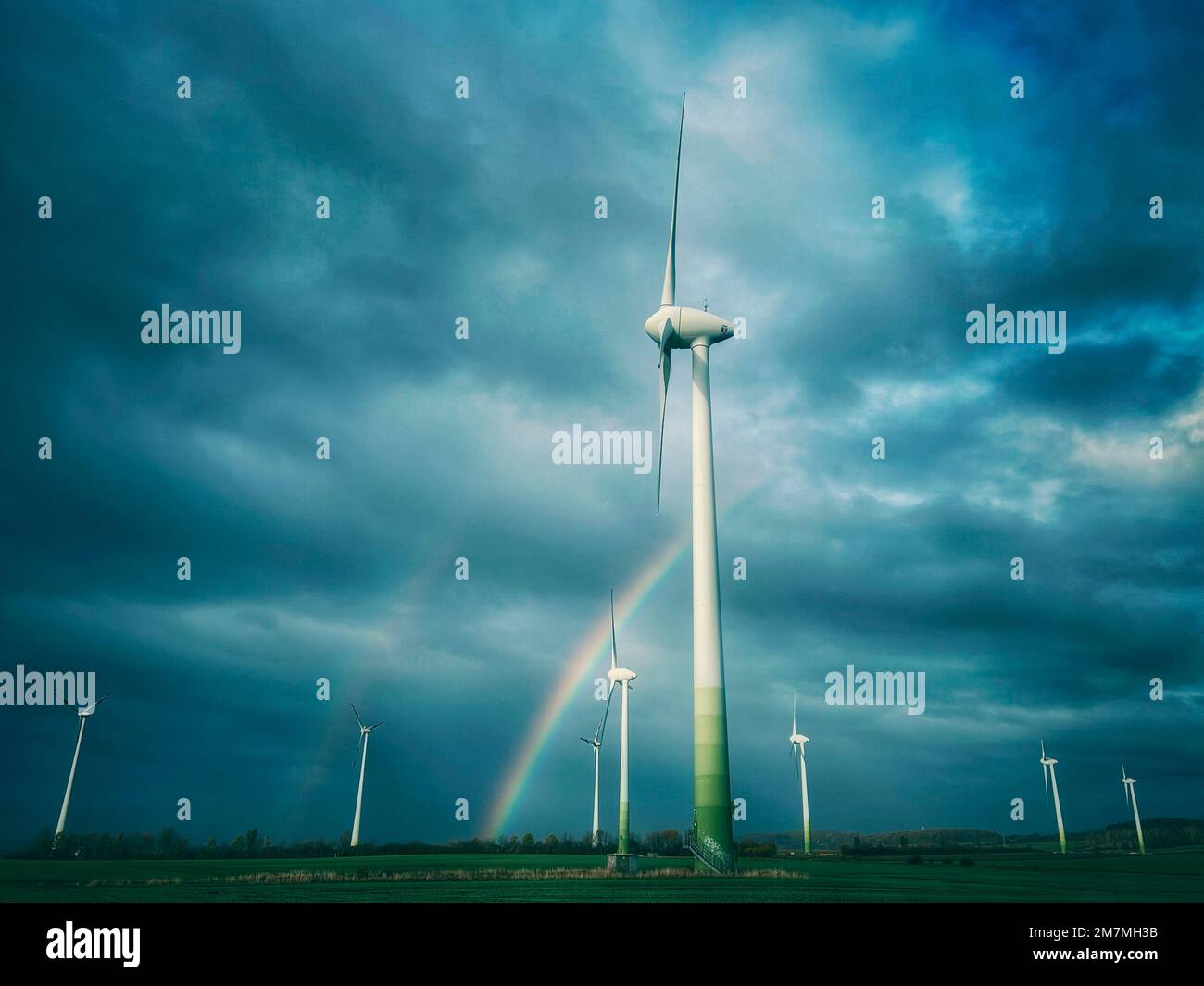 Rainbow between wind turbines Stock Photo - Alamy