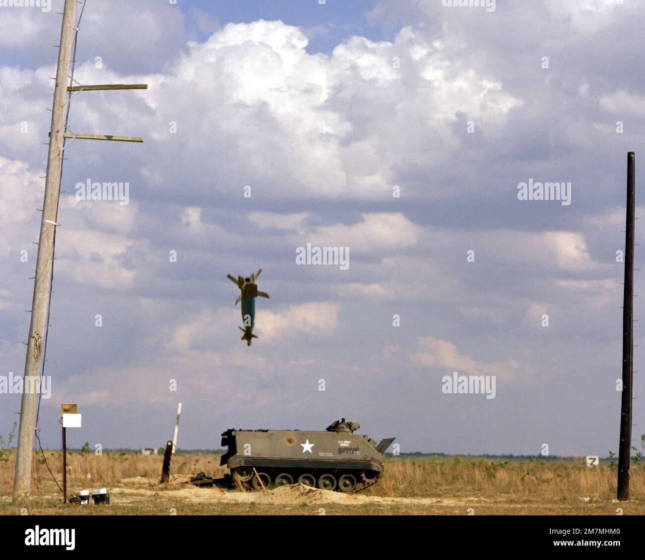 An inert Mark 84 (GBU-10) laser guided bomb homes in on an armored ...