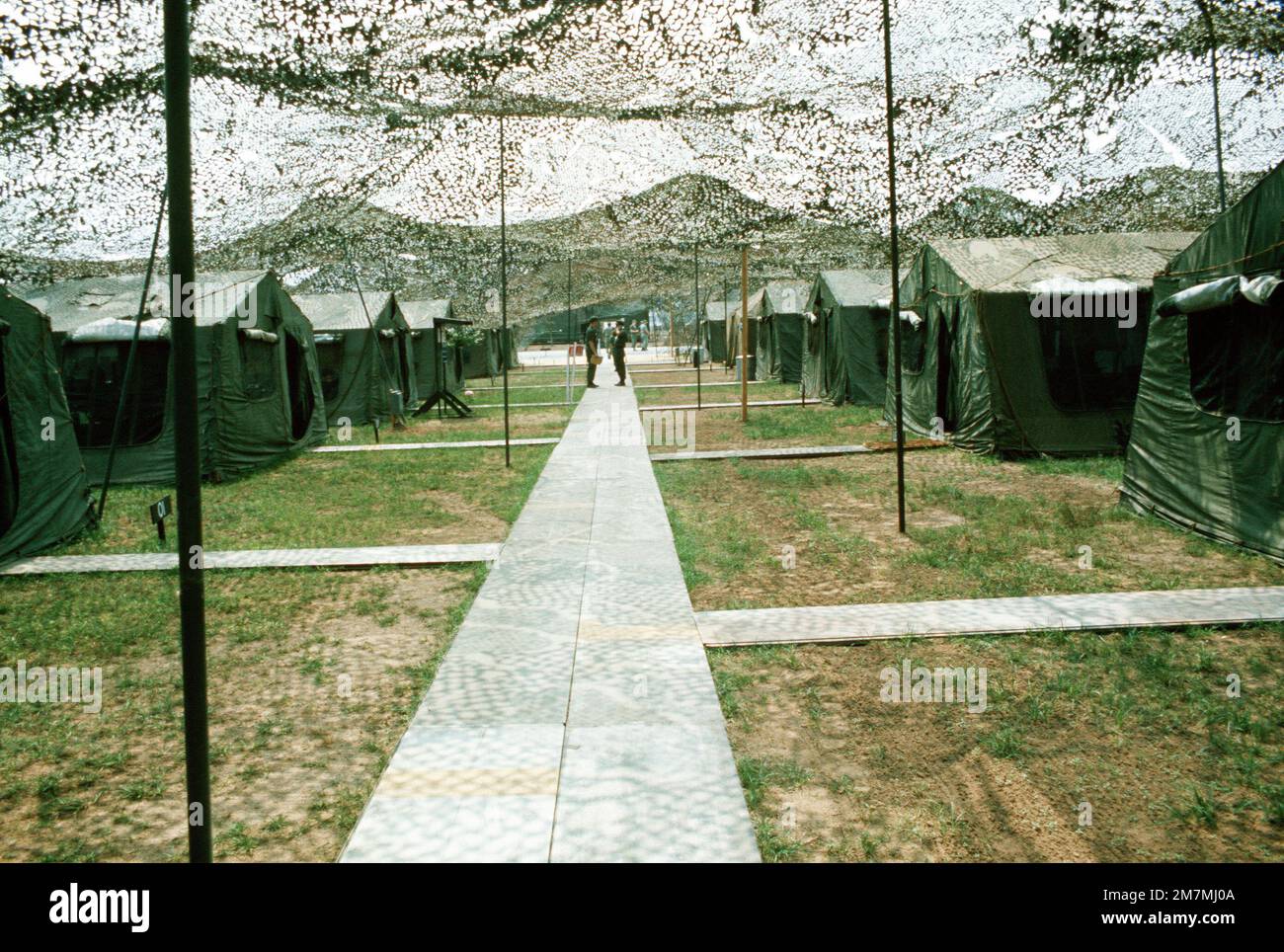 A view of a camouflaged tent complex in use during joint readiness ...