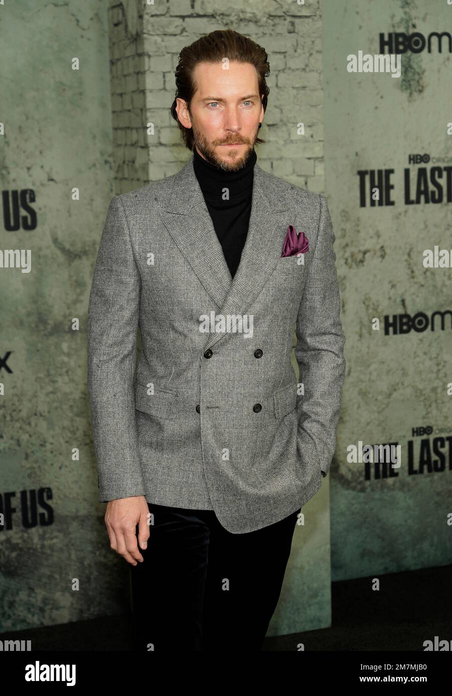 Troy Baker poses at the premiere of the HBO series "The Last of Us ...