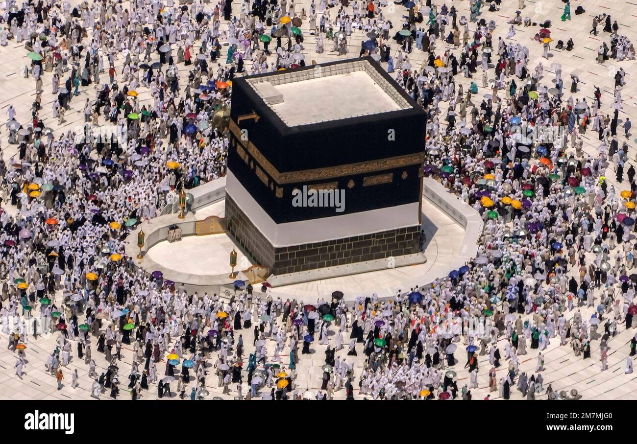 FILE - Muslim pilgrims walk around the Kaaba, the cubic building at the ...