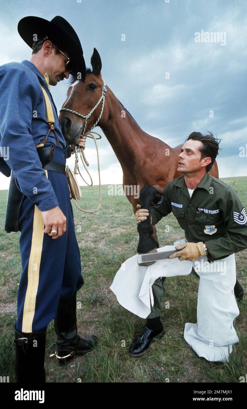 Technical Sergeant Dave Weissinger, a missile technician, does some ...