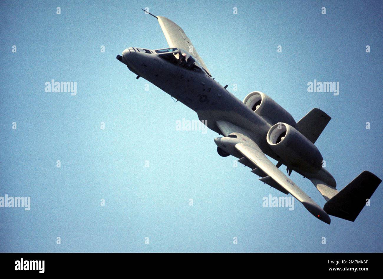An air-to-air left front view of an A-10 Thunderbolt II aircraft ...