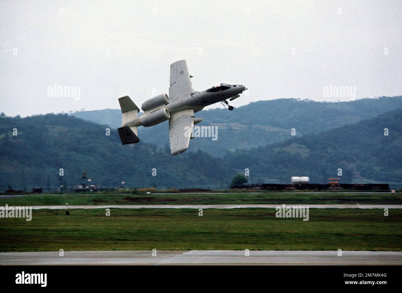 A ground-to-air view of an A-10 Thunderbolt II aircraft taking off ...