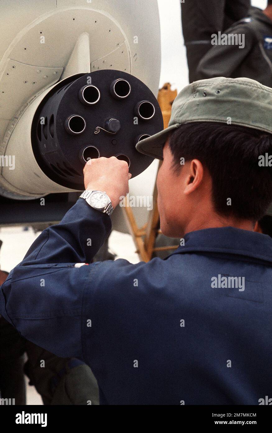 A Korean airman examines the General Electric GAU-8/A Avenger 30mm ...