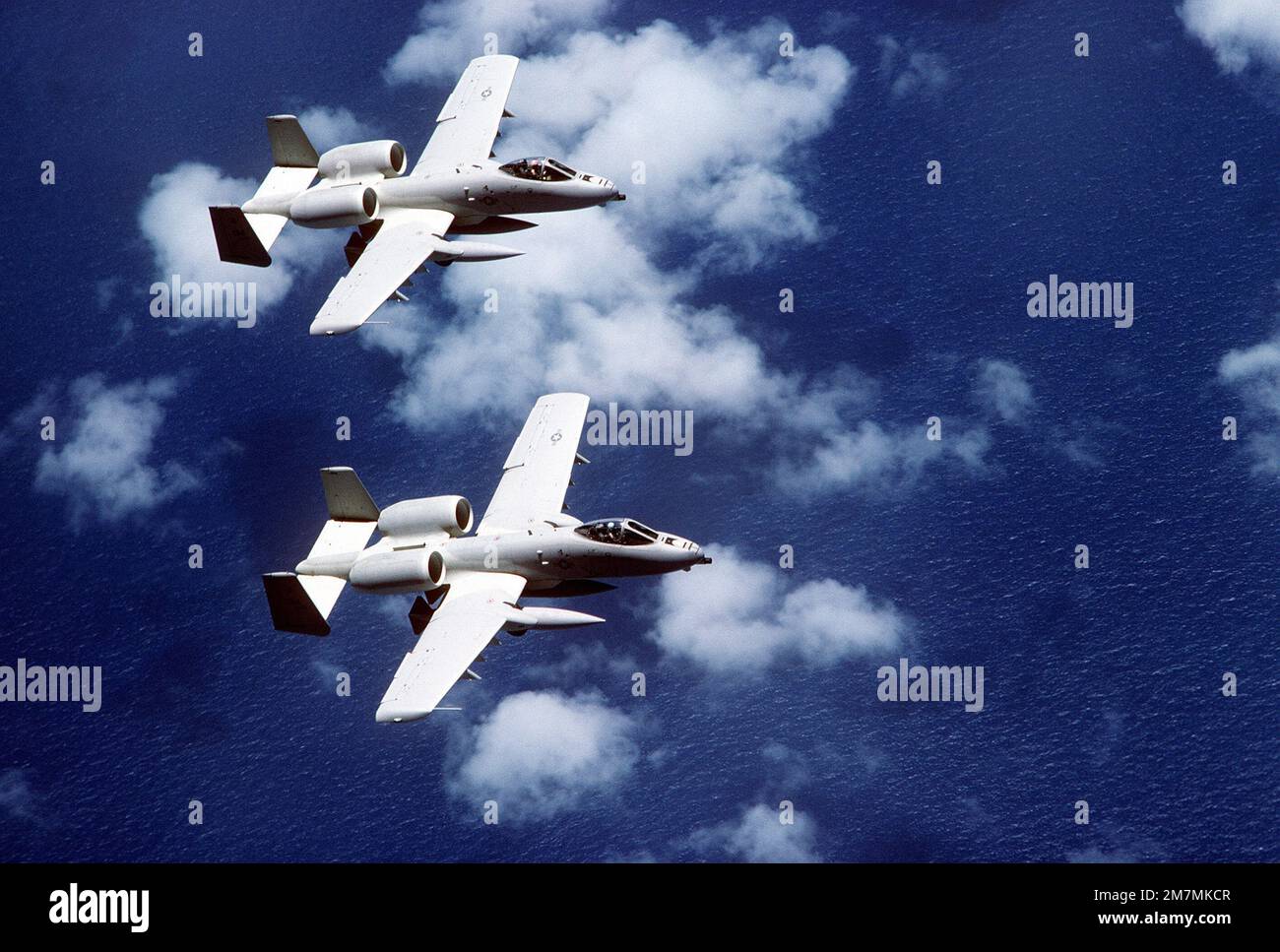 An air-to-air right topside view of two A-10 Thunderbolt II aircraft in ...