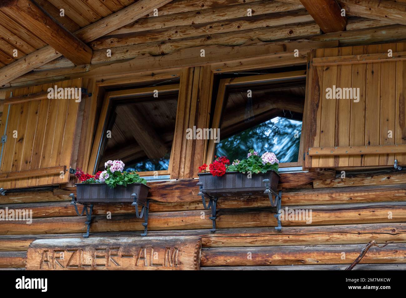 Window in the wooden facade of arzler alm hi-res stock photography and ...