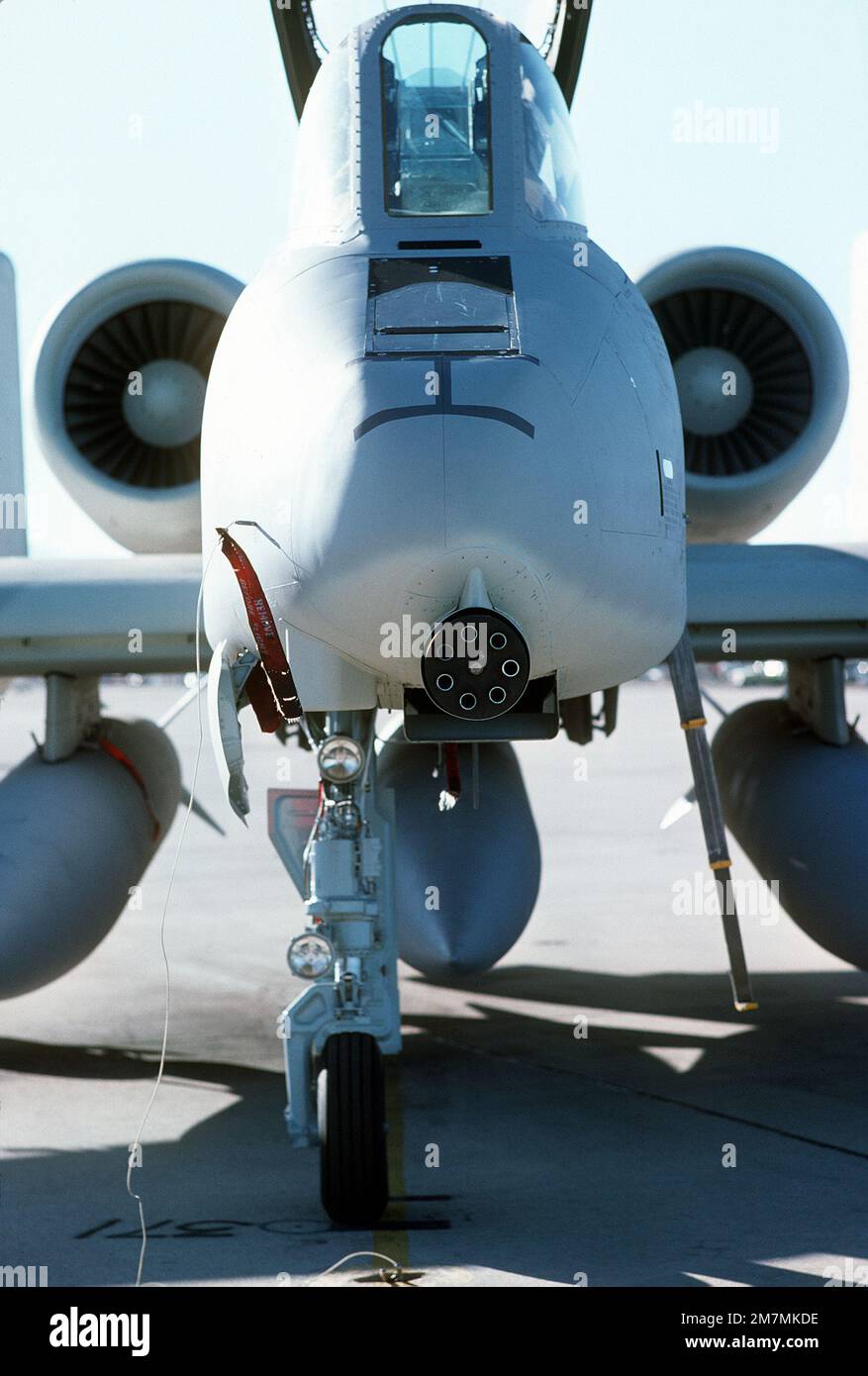 A head-on view of an A-10 Thunderbolt II aircraft parked on the flight ...