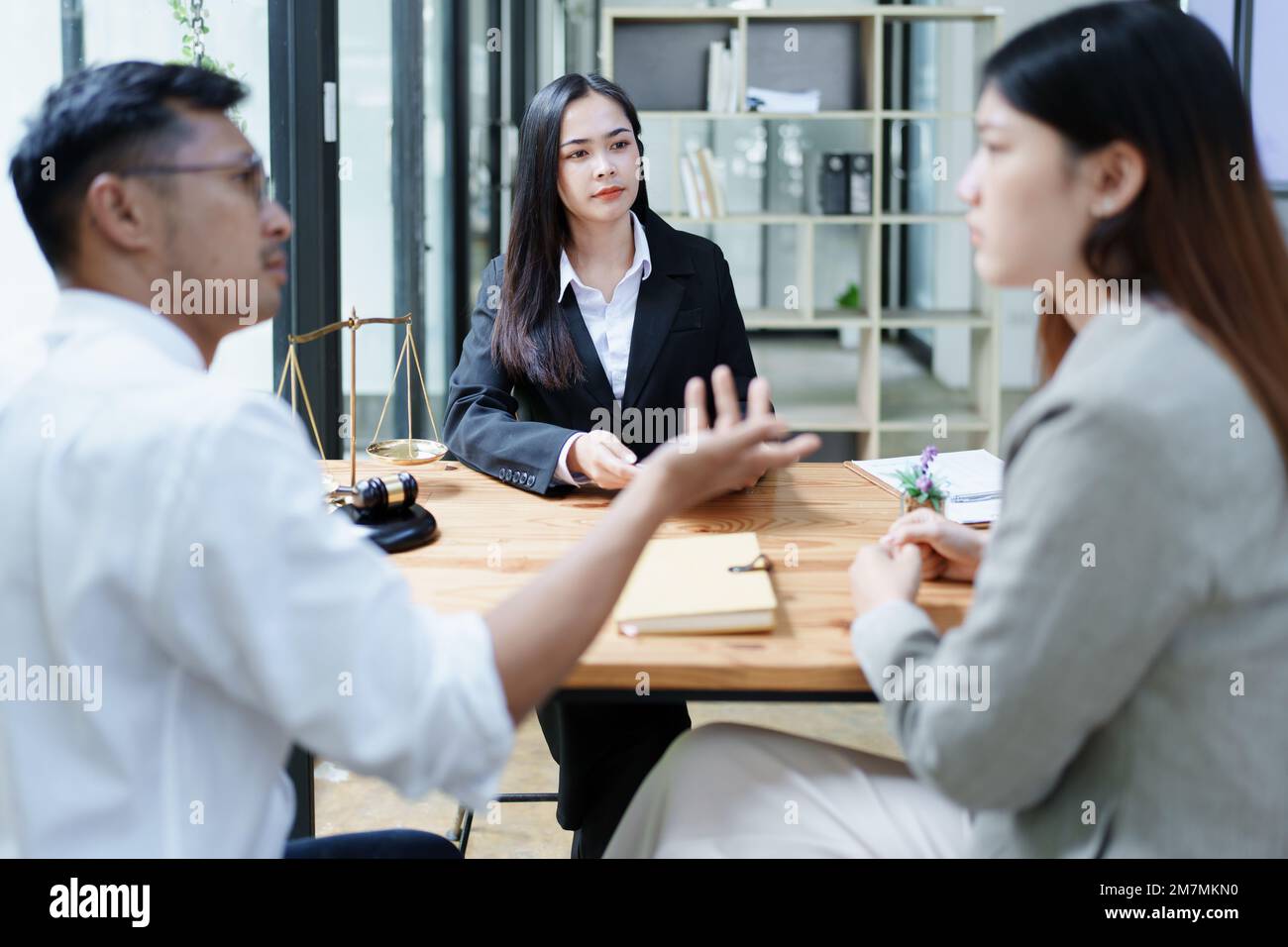 A lawyer is trying to find a legal solution in a dispute between a ...