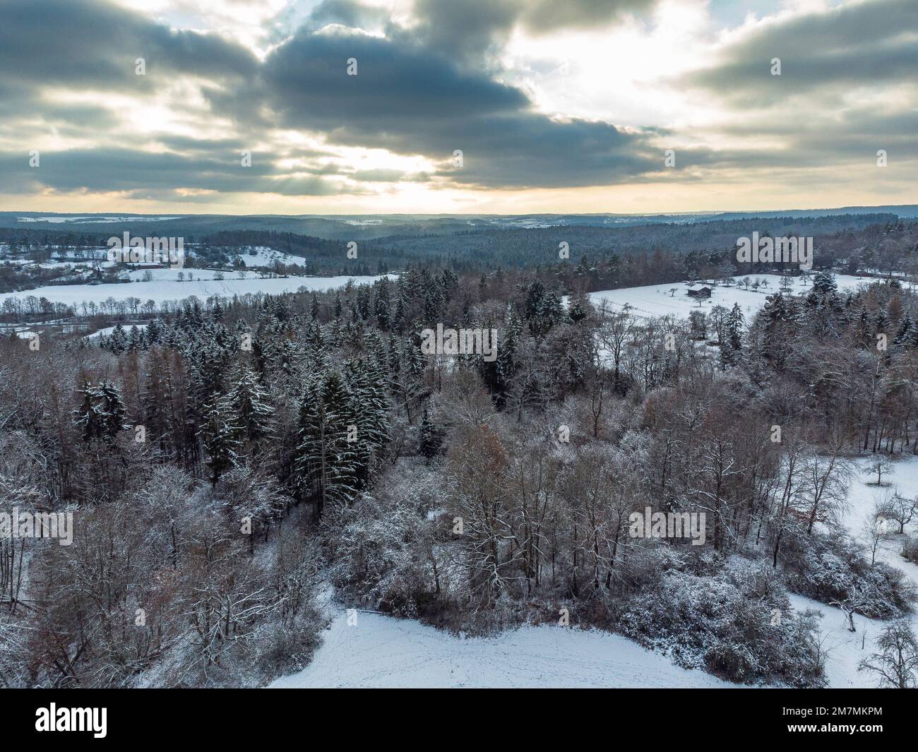 View over winter forest to the outskirts of the village hi-res stock ...