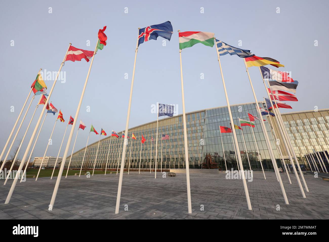 Flags of NATO members fly outside the NATO headquarters ahead of NATO ...