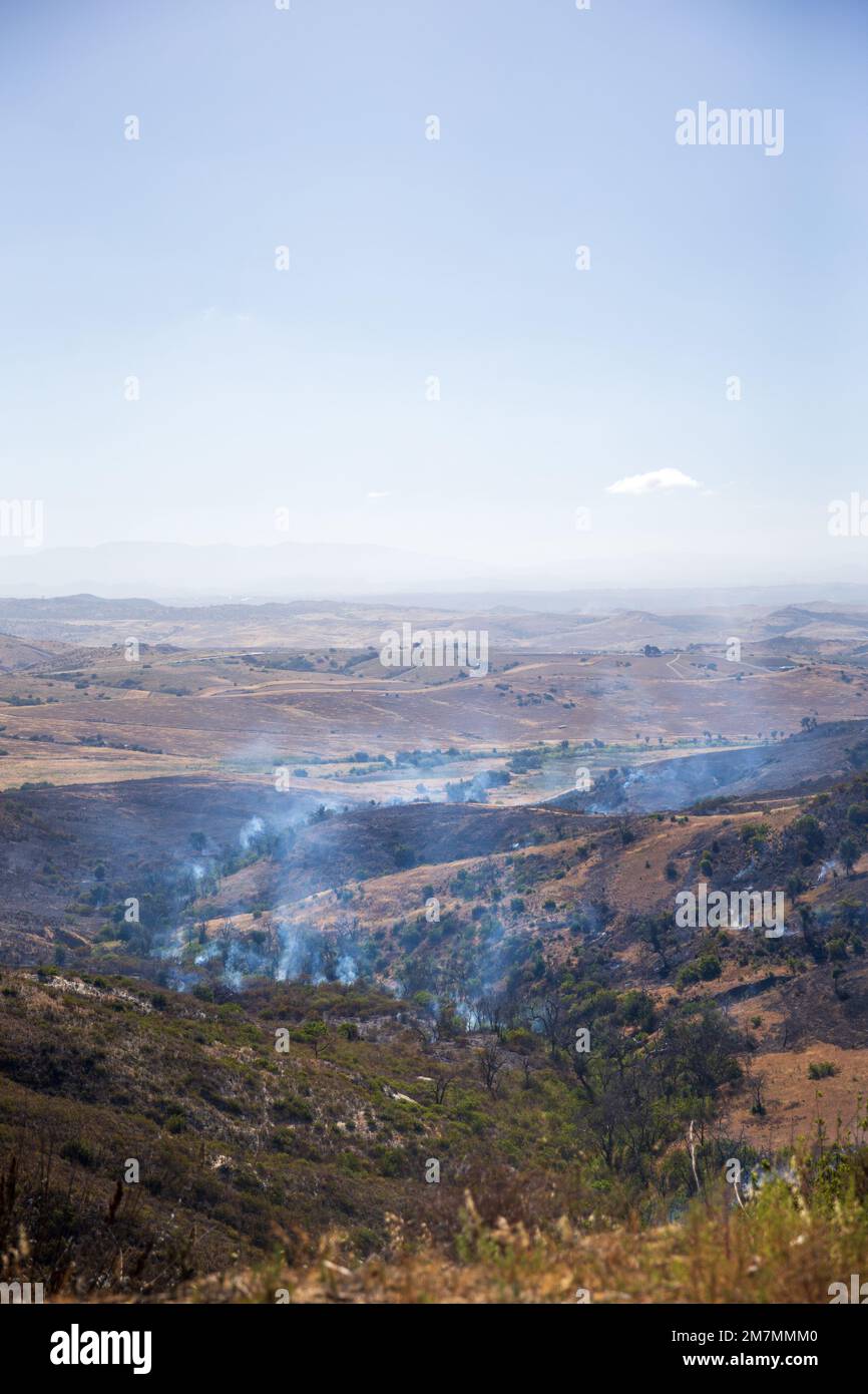 Smoke rises from a burned section of Artillery Firing Area 8 on Marine ...