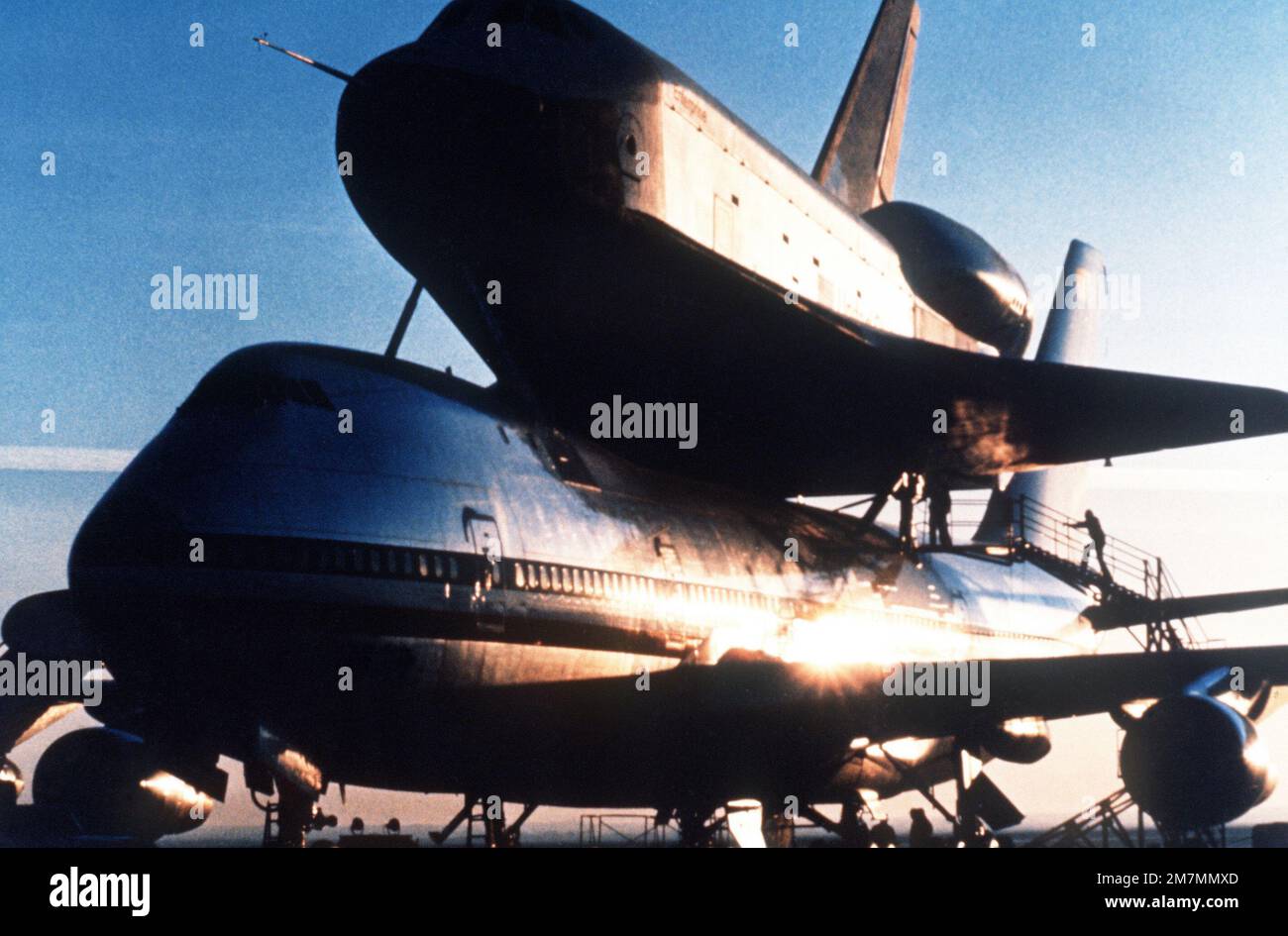 Space shuttle orbiter OV-101 Enterprise sits atop the fuselage of a ...