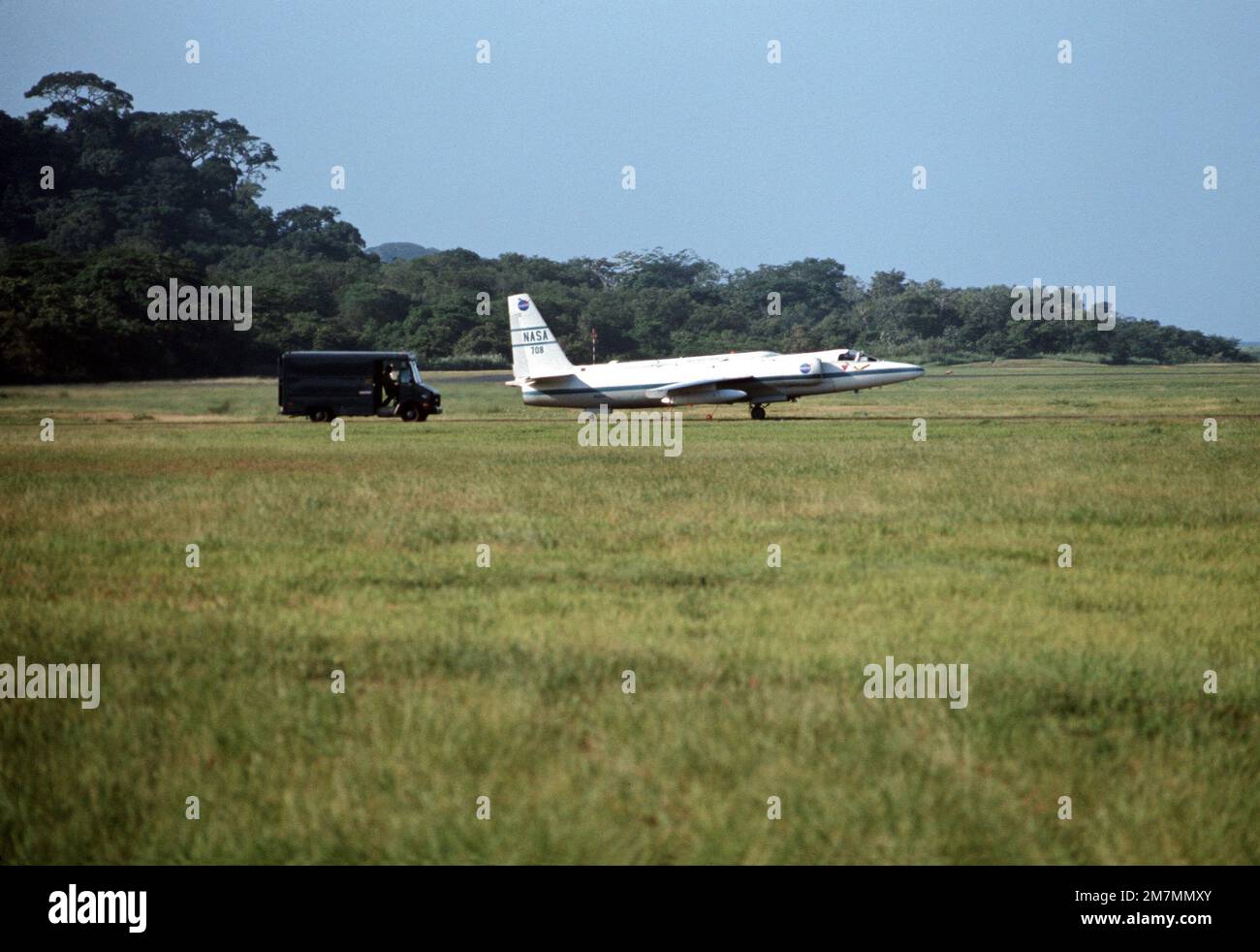 A NASA U-2 Earth Survey aircraft taxis out to the runway followed by a ...