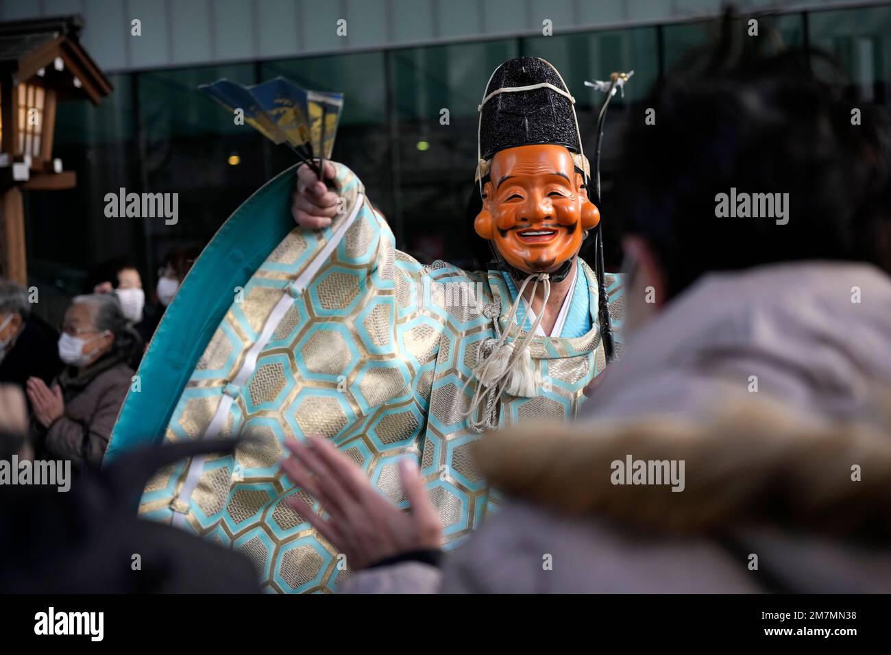 An artist depicting Ebisu, the god of fishermen and good fortune, one ...