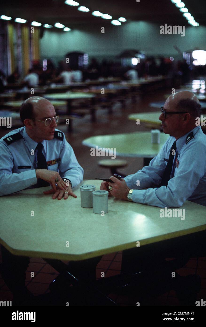 Lieutenant Colonel Karl Baumwell and Captain Ken Brady chat in a dining ...
