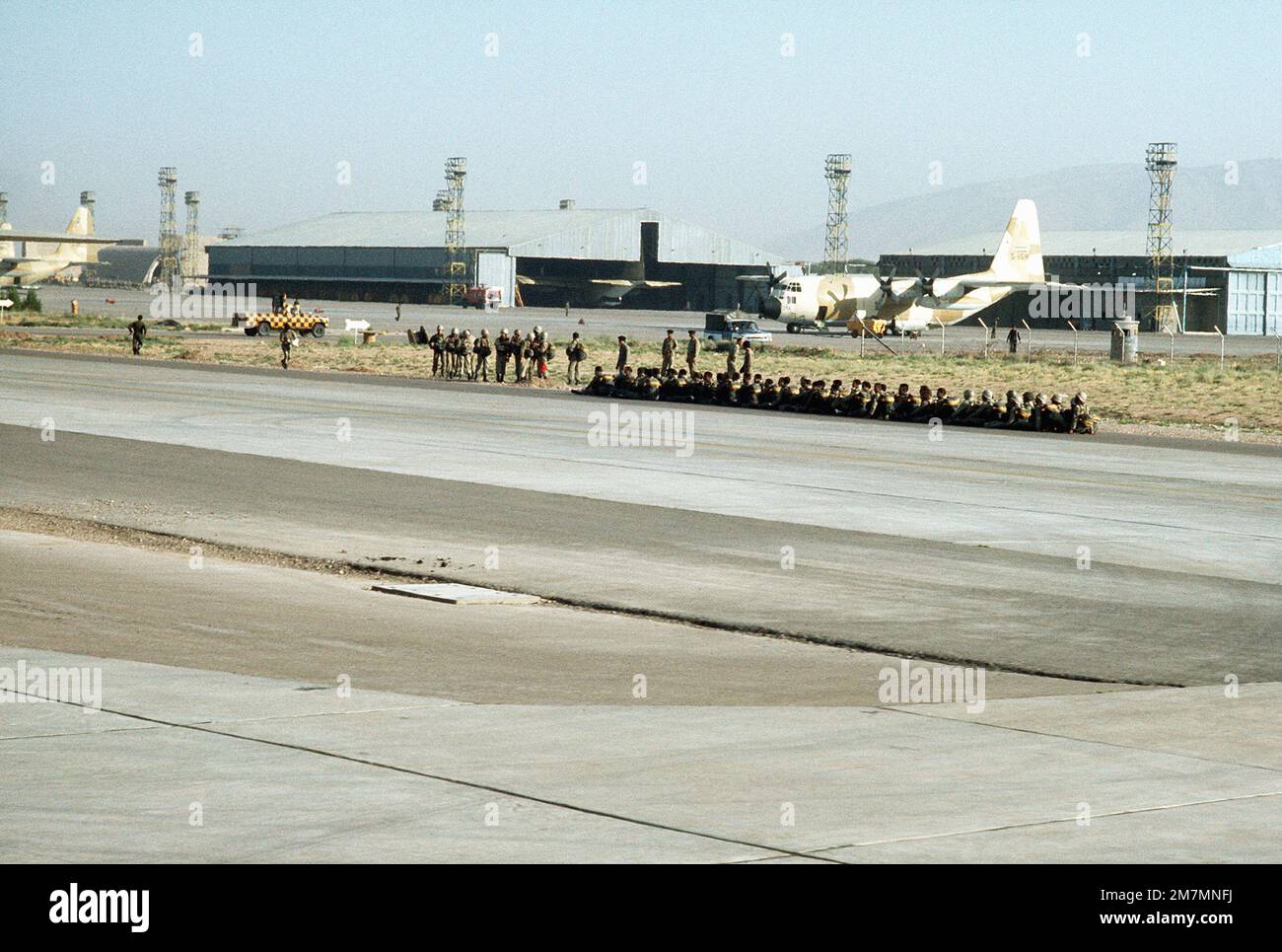 Iranian paratroopers wait at Shiraz Air Base to board a C-130 Hercules ...