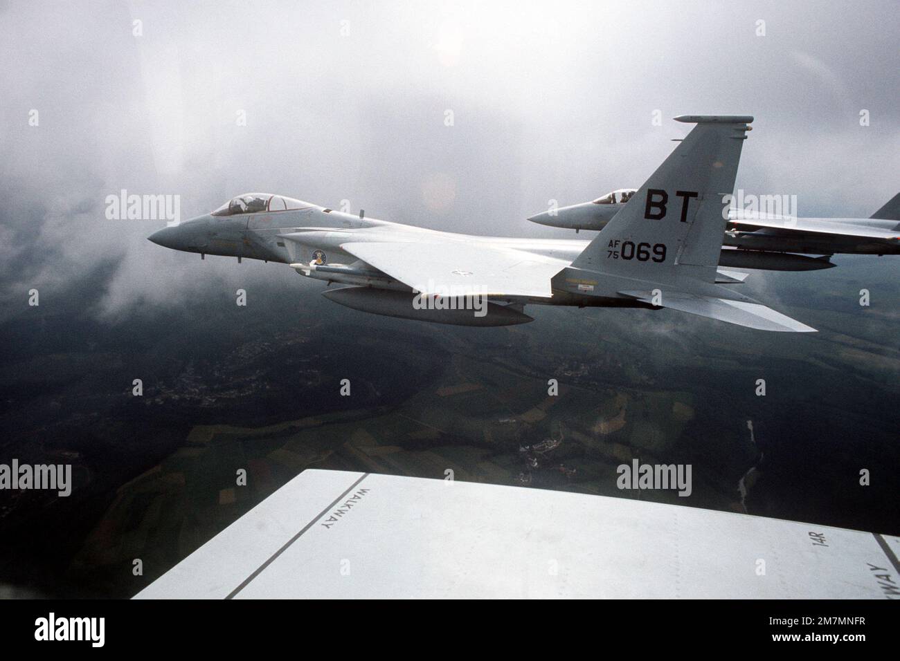 A left side air-to-air view of an F-15 Eagle aircraft, from the 36th ...