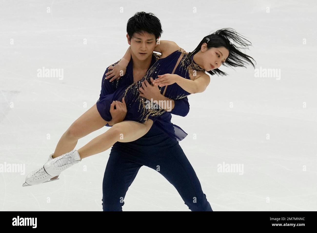 Japanese pairs figure skaters Riku Miura and Ryuichi Kihara compete in ...