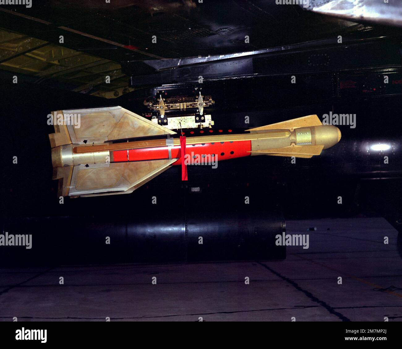 A GBU-15 (GW) bomb is mounted on the wing pylon of a B-52 ...