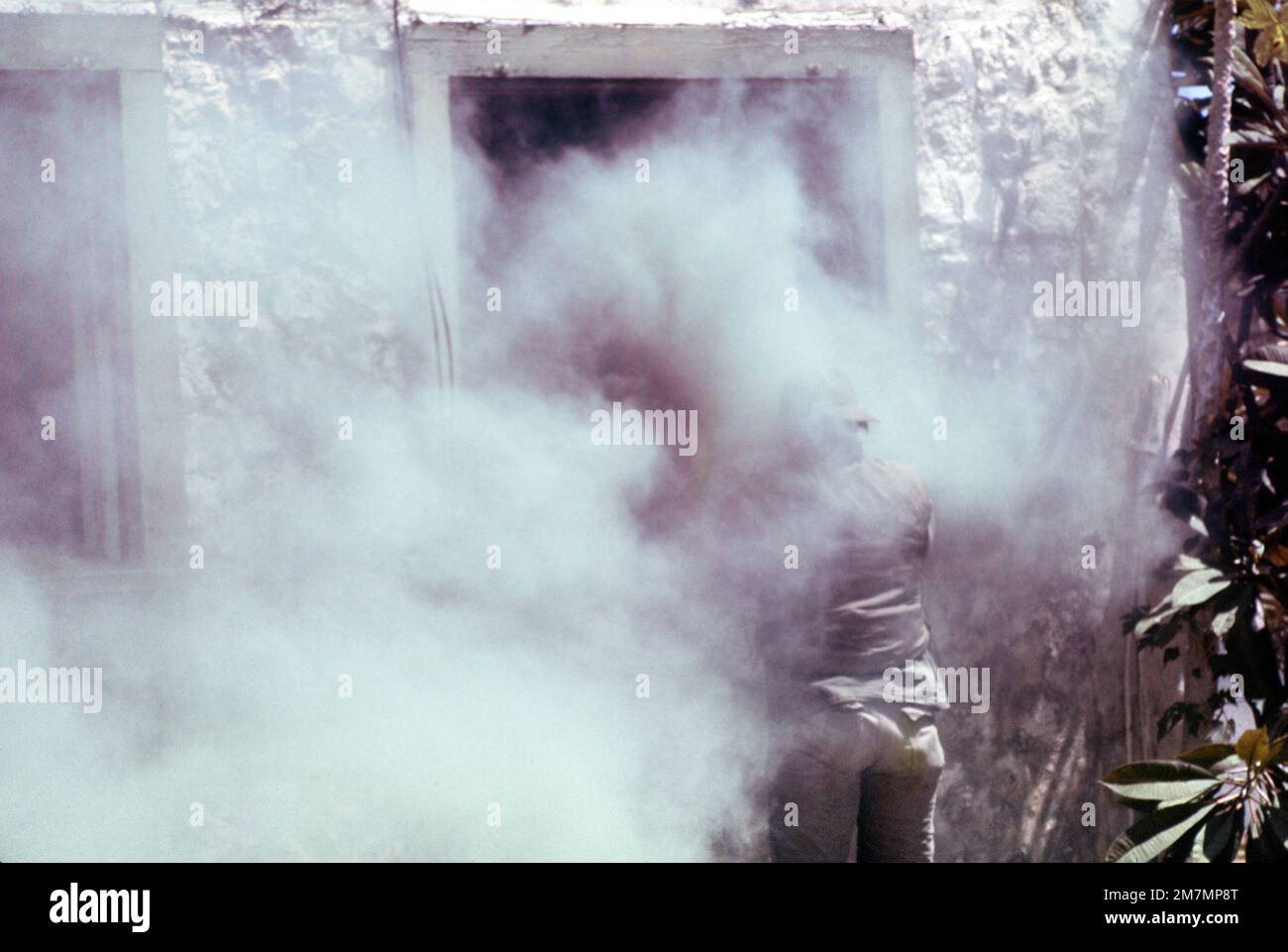 An Air Force security policeman prepares to enter a smoke-filled ...