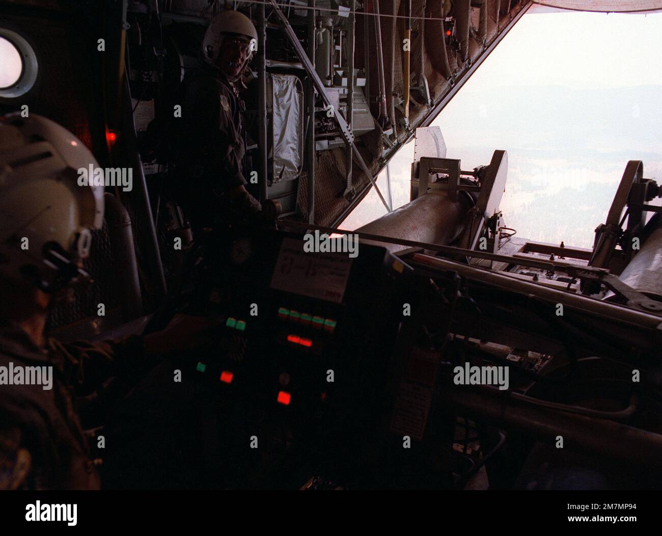 Airmen aboard a Mobile Aerial Fire Fighting System C-130 Hercules ...
