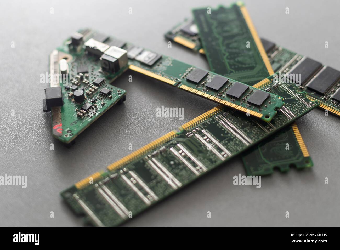 Macro Close up of computer RAM chip and motherboard on dark background ...