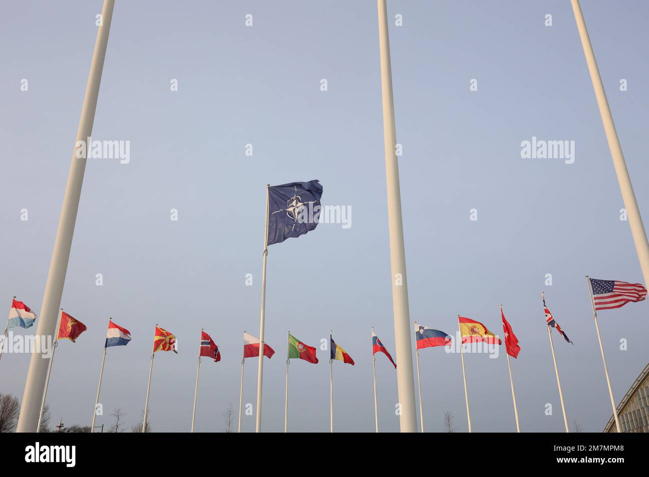 Flags of NATO members fly outside the NATO headquarters ahead of NATO ...