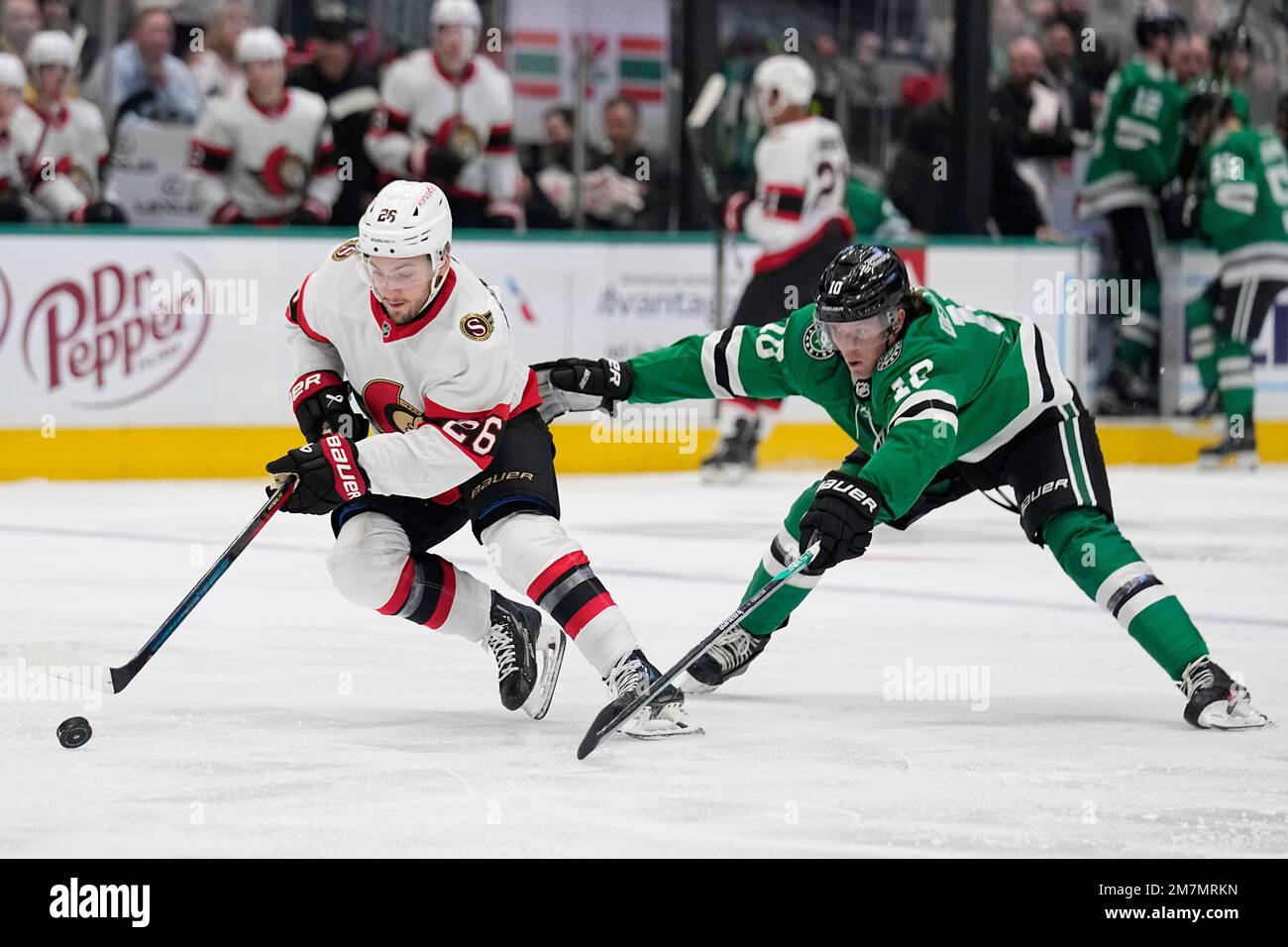 Ottawa Senators defenseman Erik Brannstrom (26) takes control of the ...