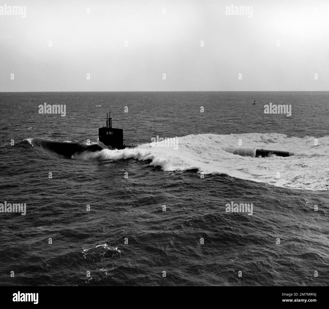 Aerial port view of the nuclear-powered attack submarine USS MEMPHIS ...