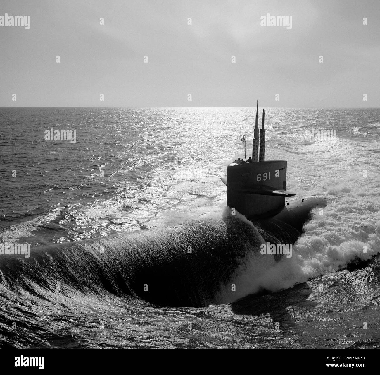 An aerial port bow view of the nuclear-powered attack submarine USS ...