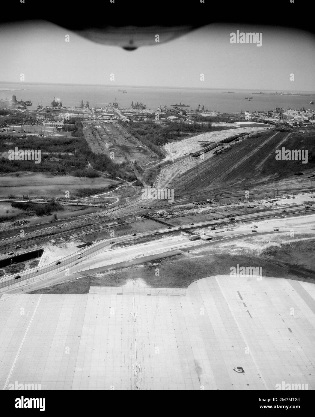 An aerial view of the destroyer and submarine piers. Base: Naval Air ...
