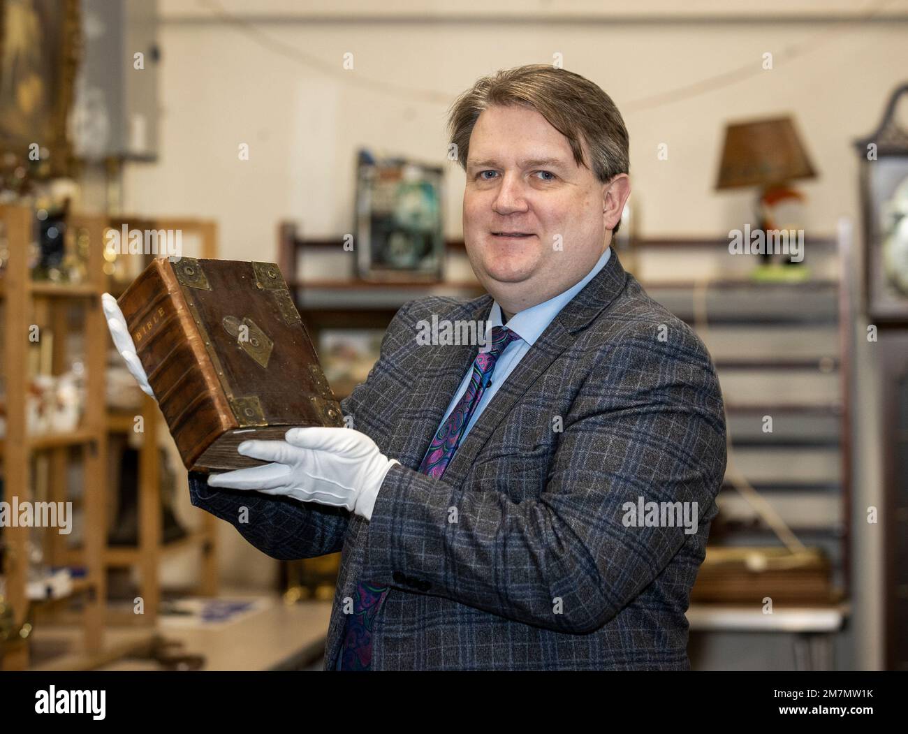 Bloomfield Auctions' managing director Karl Bennett holding a Breeches ...