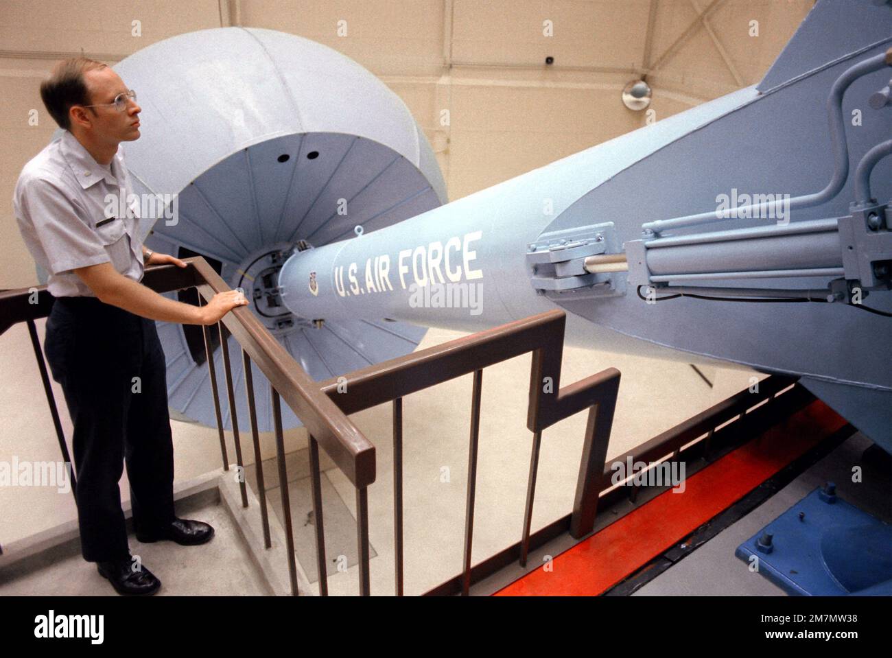 LT. Jackson, on stairs, poses with a LEMARS fighter aircraft flight ...