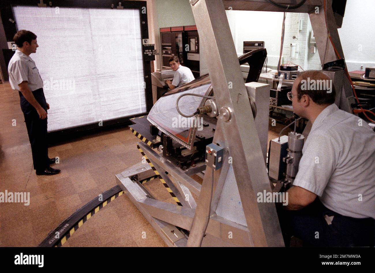 Equipment specialist John Frazier, right, operates as test director ...