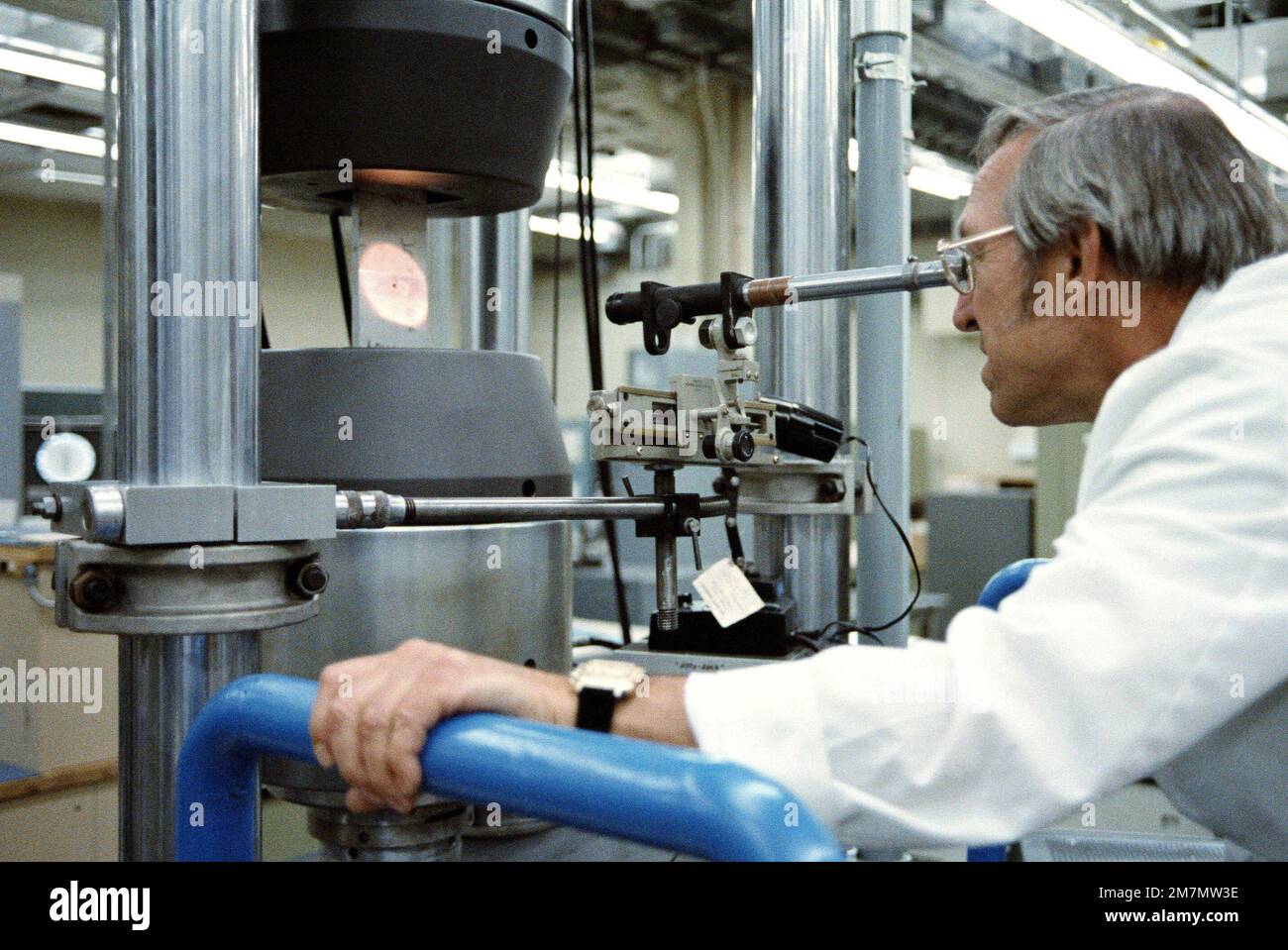 SENIOR laboratory technician Dale Opela looks through the optical ...