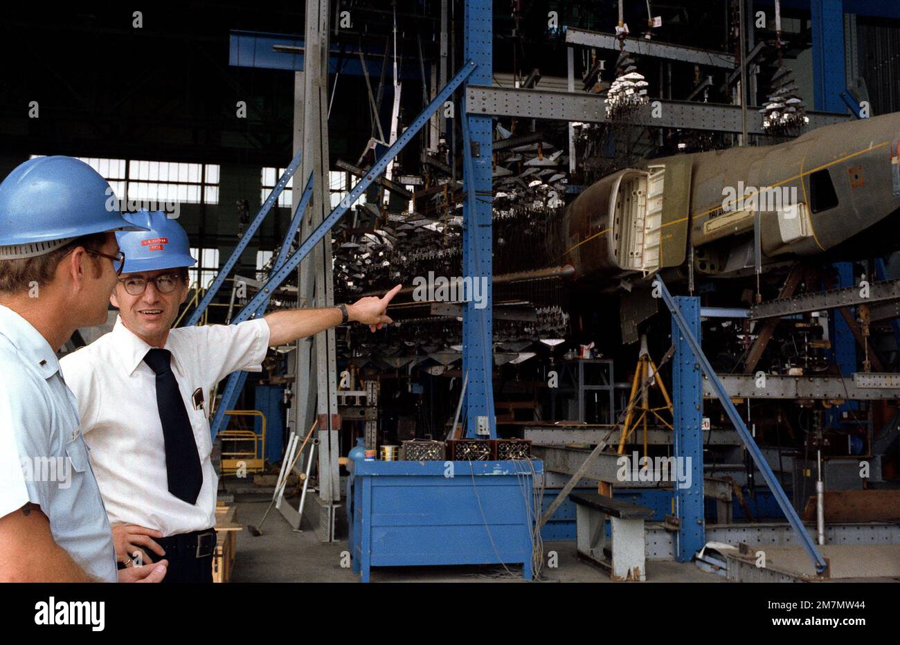 Instrumentation engineer John Pappas points out modifications of an F-4 Fatigue Bird aircraft to ...