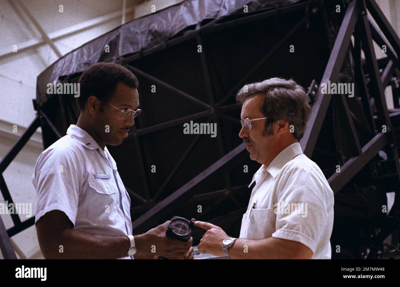 Second LT. John Alston (right), speaks with Lear Siegler Inc. employee ...
