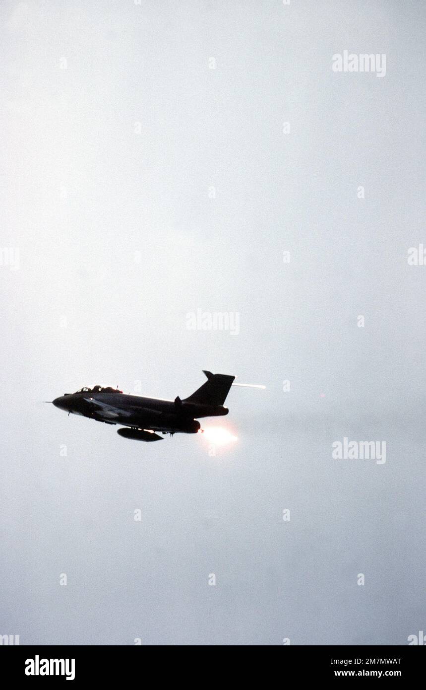 A left rear view of an F-101 Voodoo aircraft in flight. The aircraft is ...