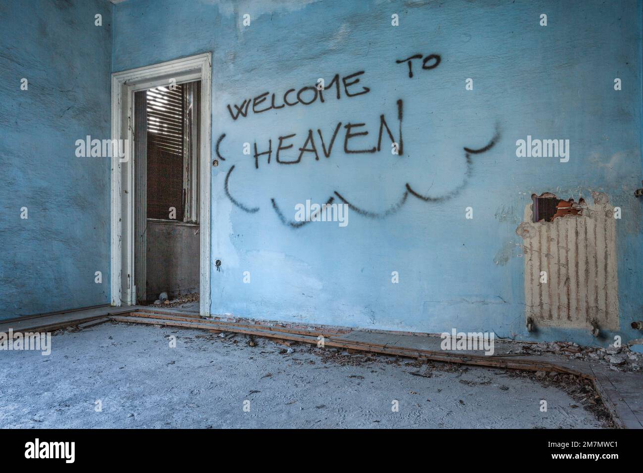 Italy, Veneto, dusty room of an abandoned house, "welcome to heaven ...