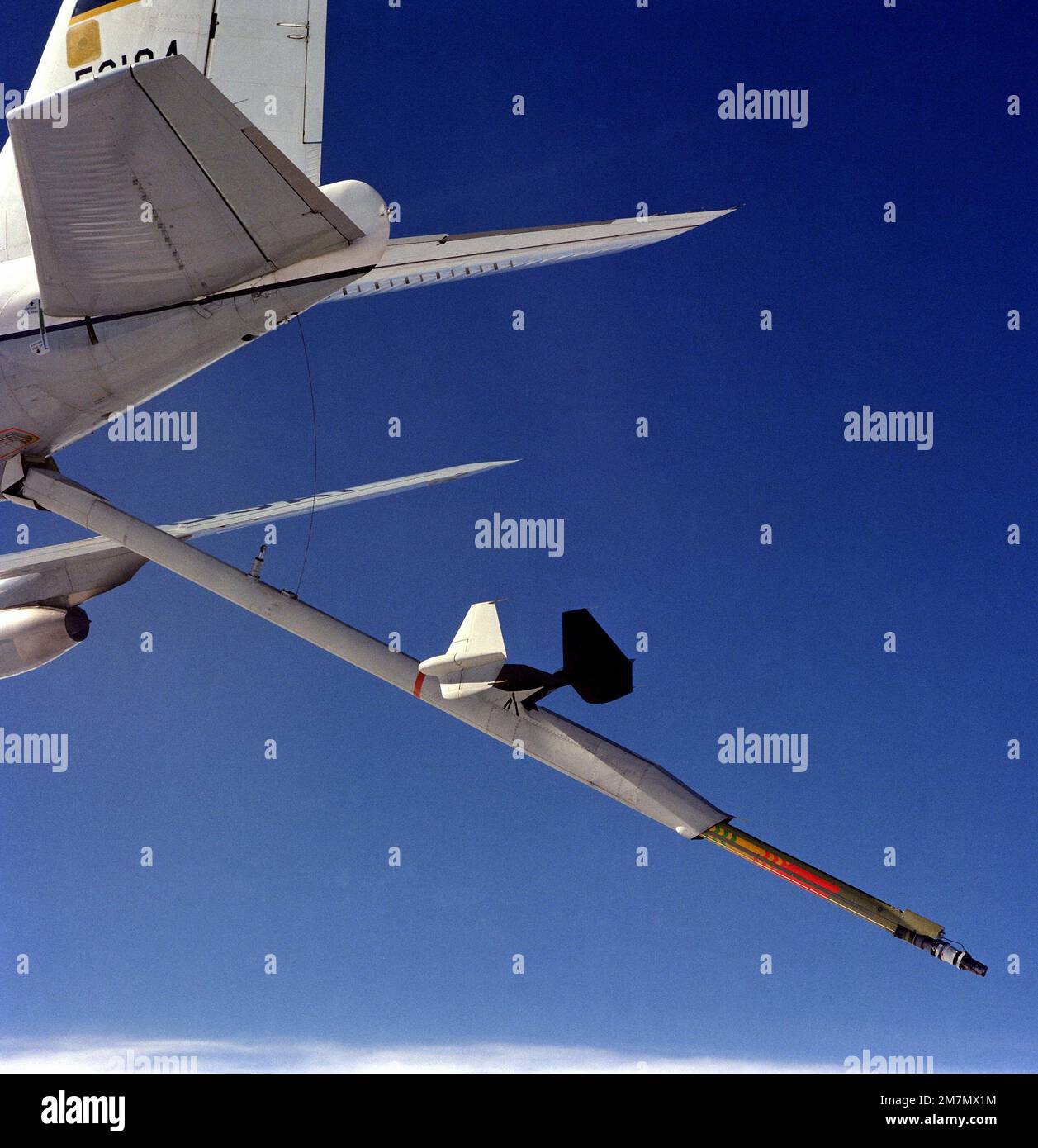 An air-to-air view of the Advanced Aerial Refueling Boom between an F-4 ...