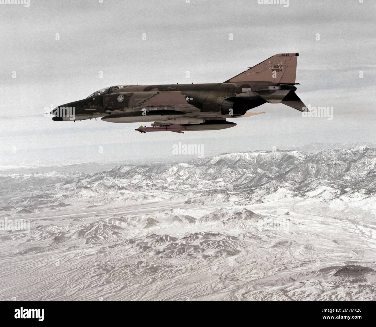 An air-to-air left side view of an F-4 Phantom II aircraft over the ...