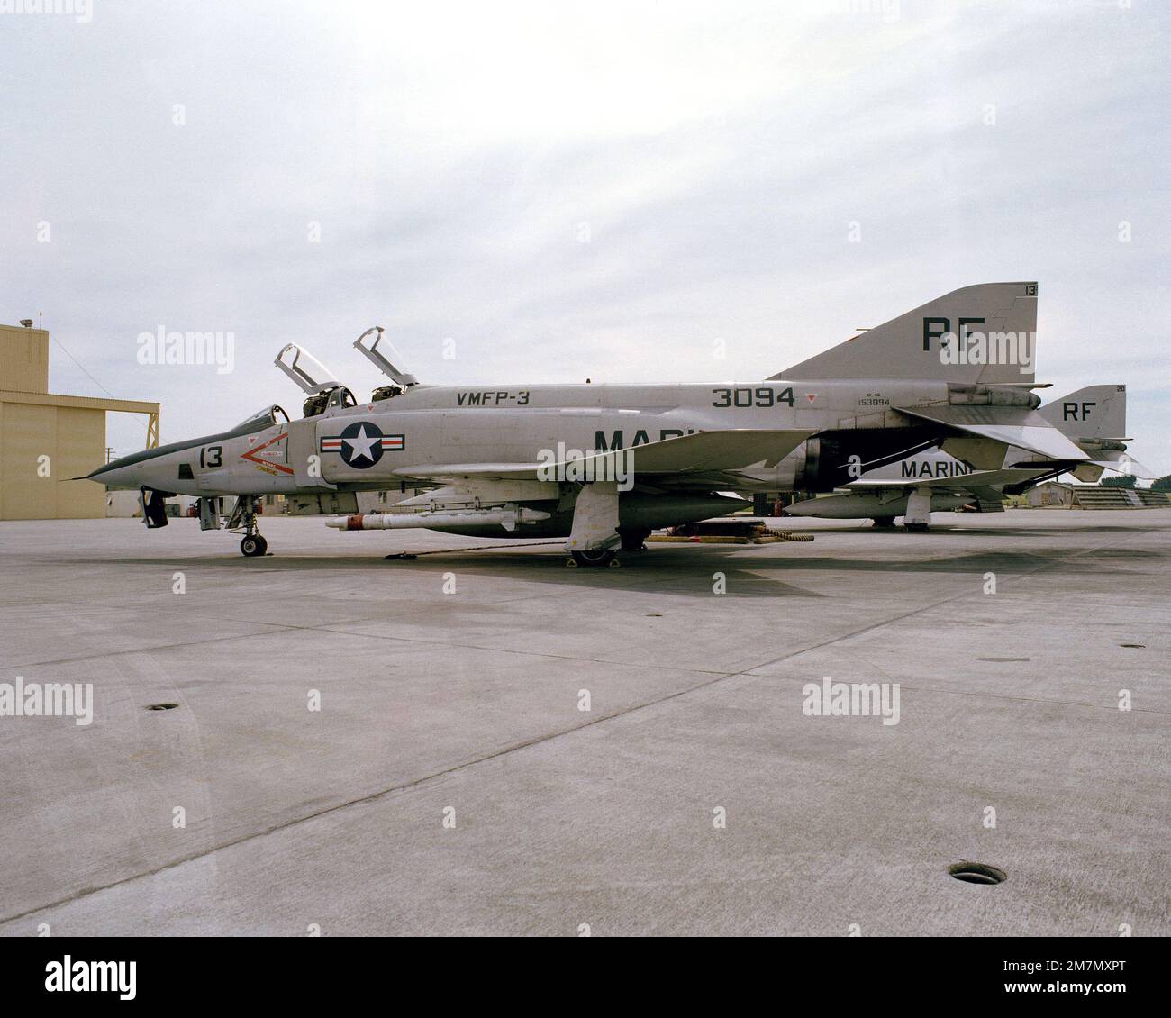 A left side view of an RF-4B Phantom II aircraft on the flight line ...