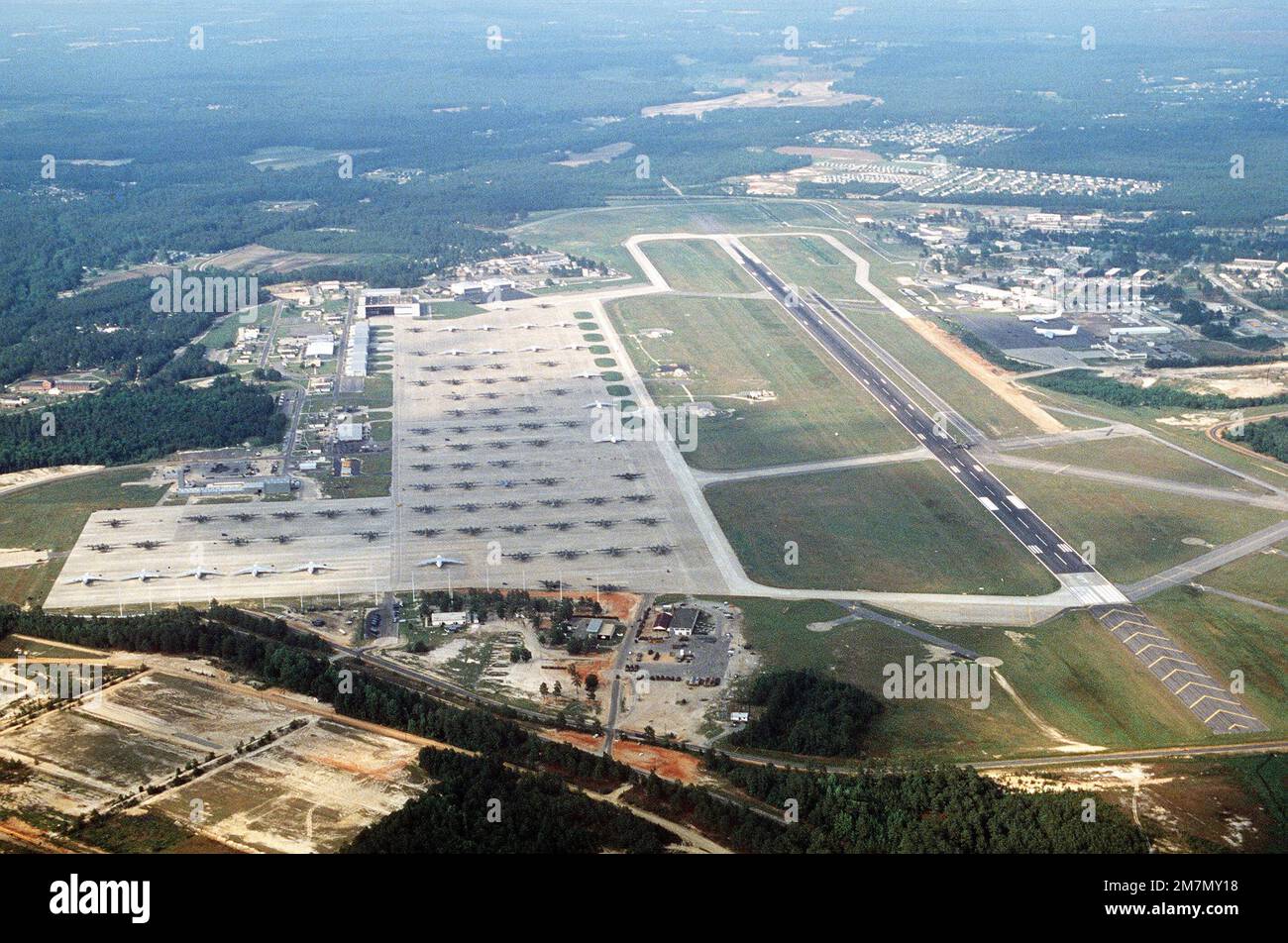 An aerial view of C-141 Starlifter and C-130 Hercules aircraft parked ...