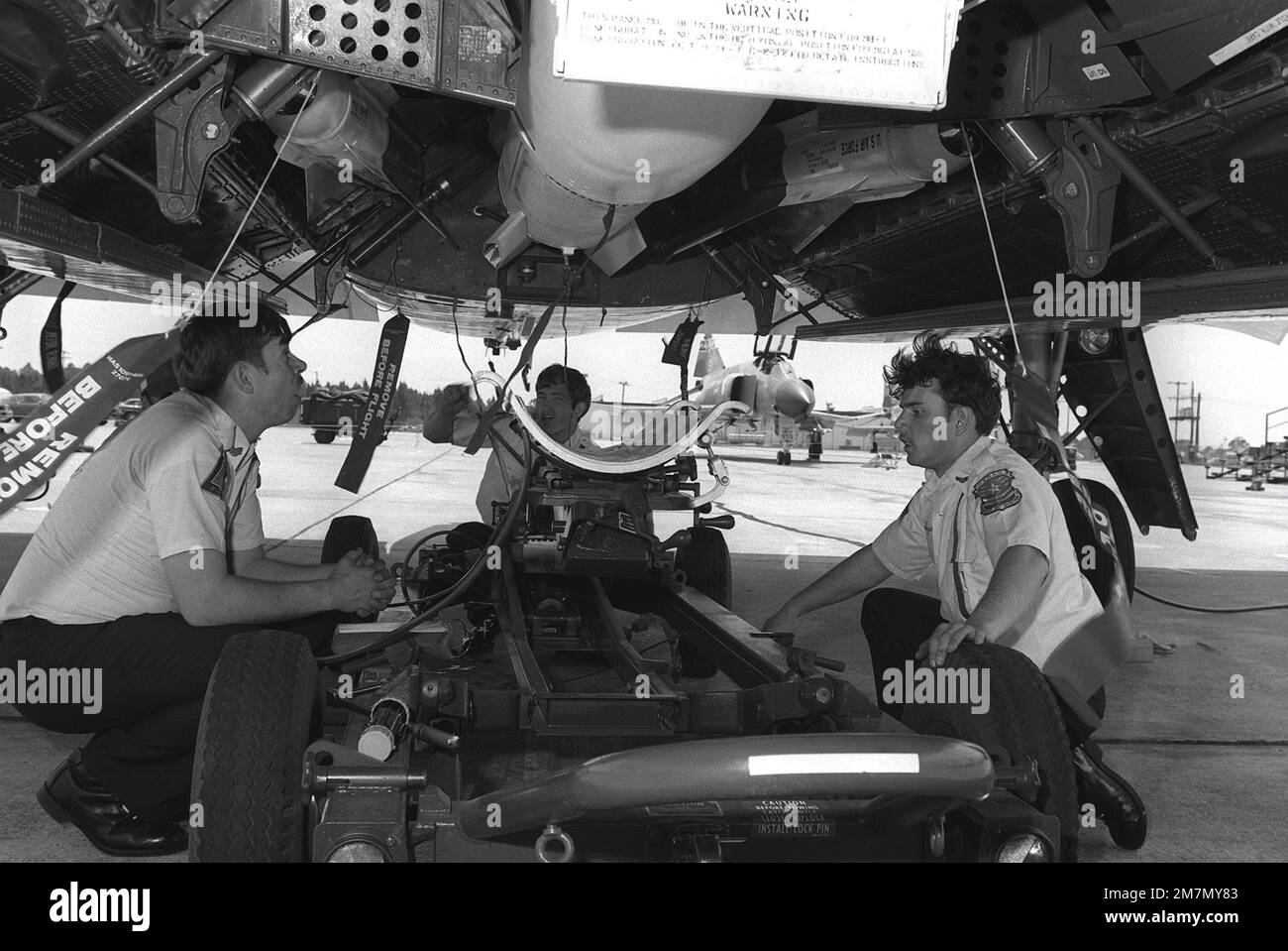 Personnel of the 318th Fighter Interceptor Squadron inspect a training ...